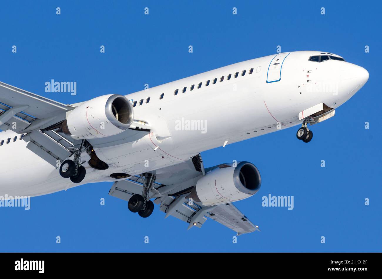 Passenger airplane with the chassis released before the landing at the ...