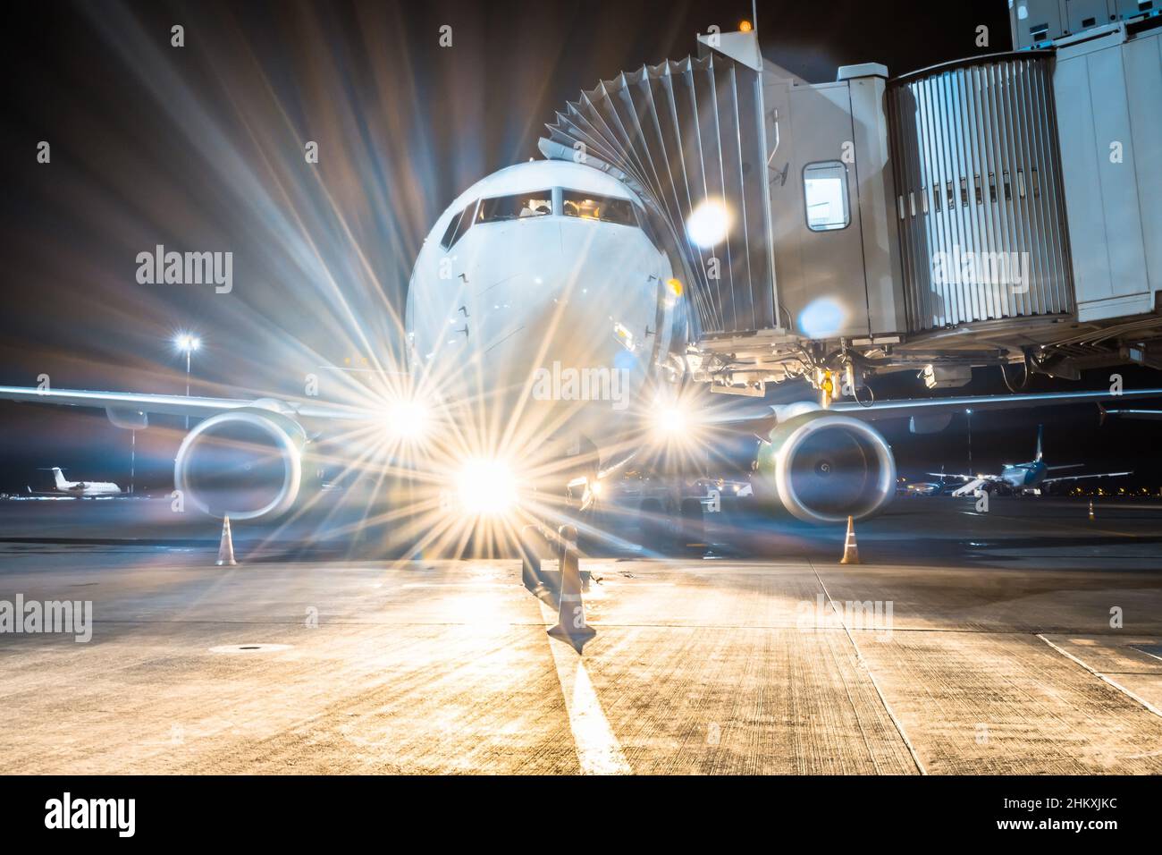 Aircraft apron at the parking gangway at the airport at night with the ...