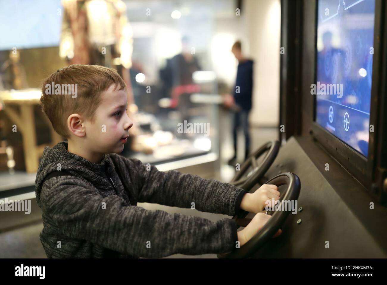 Portrait of boy playing racing simulator game Stock Photo - Alamy
