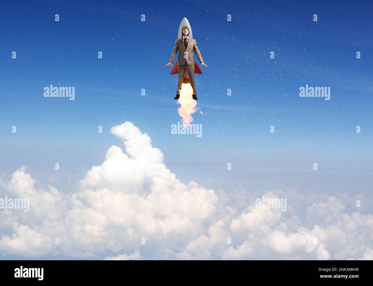 Business person in aviator hat flying on rocket Stock Photo - Alamy