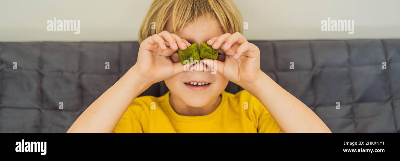 Boy eating green Matcha candy. Homemade Matcha BANNER, LONG FORMAT ...