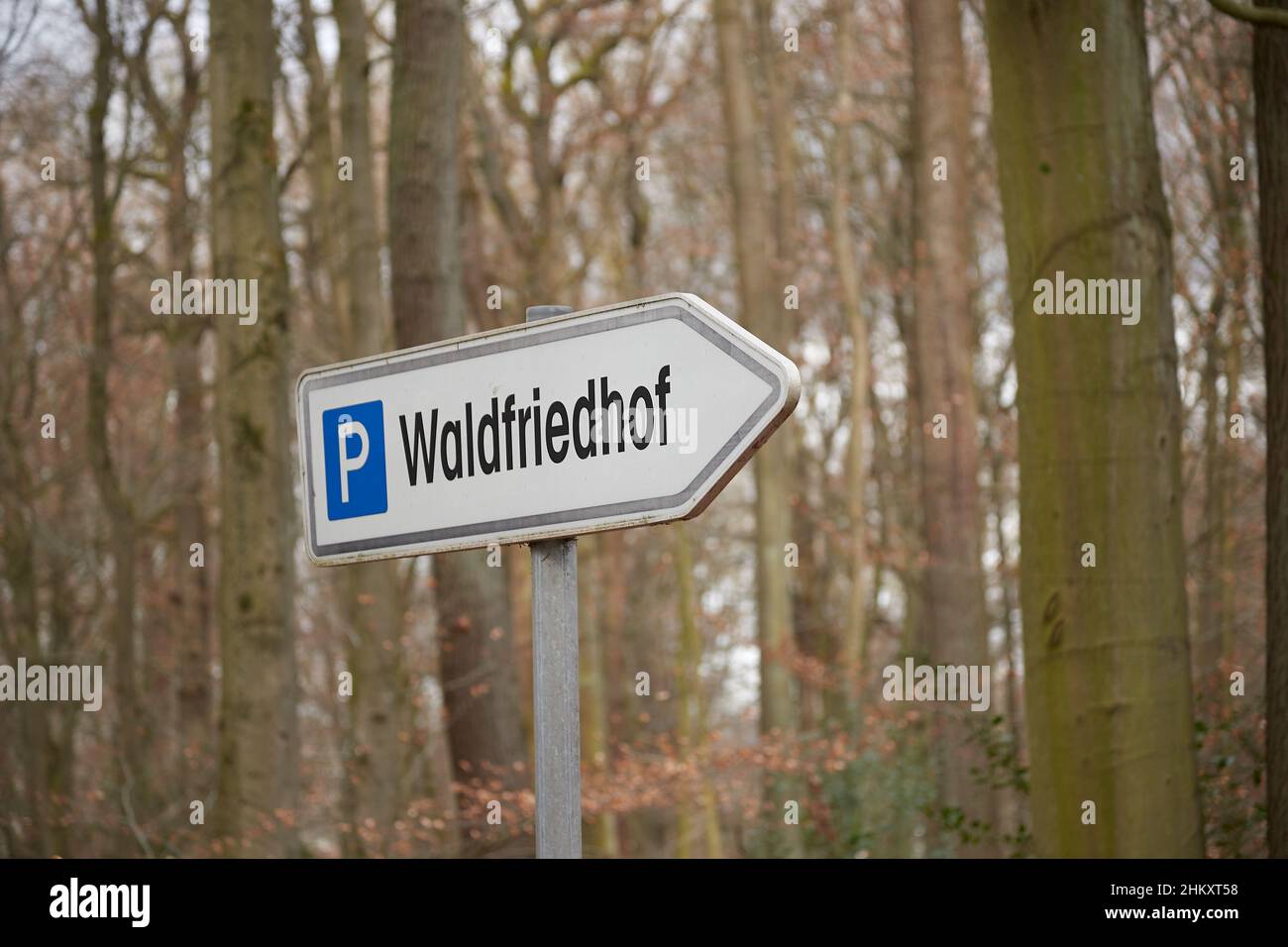 German sign showing direction to the parking area of a cemetery in the ...