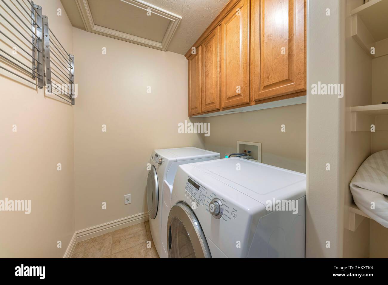 Small laundry room interior with wall-mounted drying rack Stock Photo ...