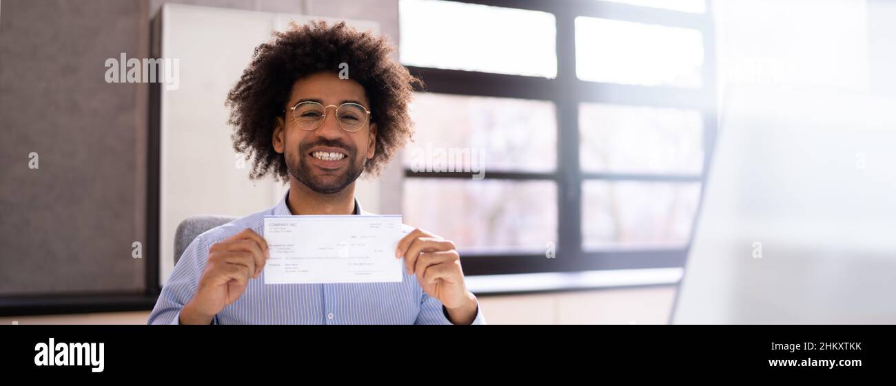 Holding Paycheck Or Payroll Check Or Insurance Cheque In Hand Stock ...