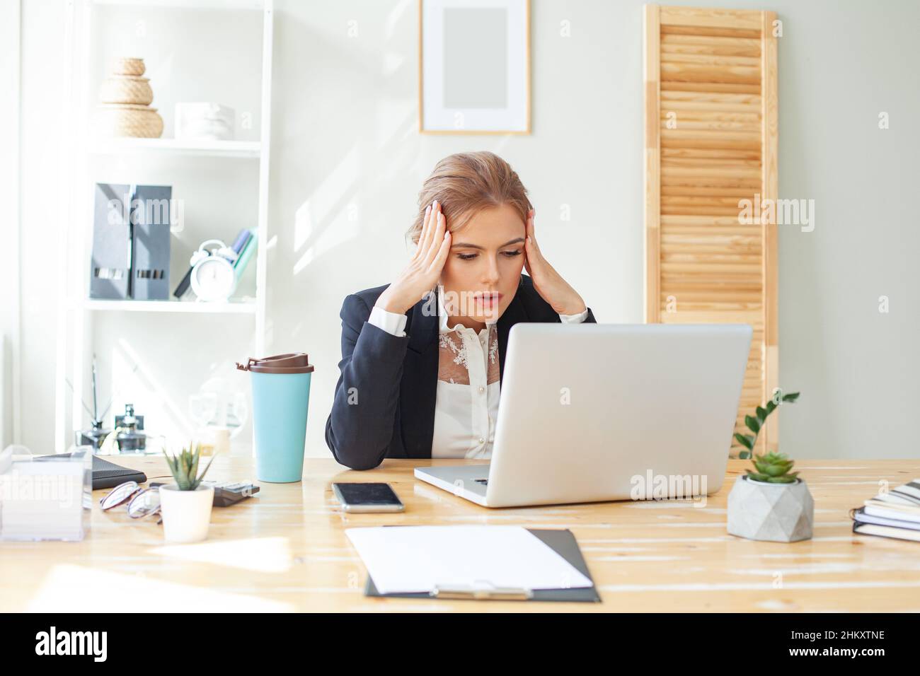 Business woman having headache at office Stock Photo - Alamy