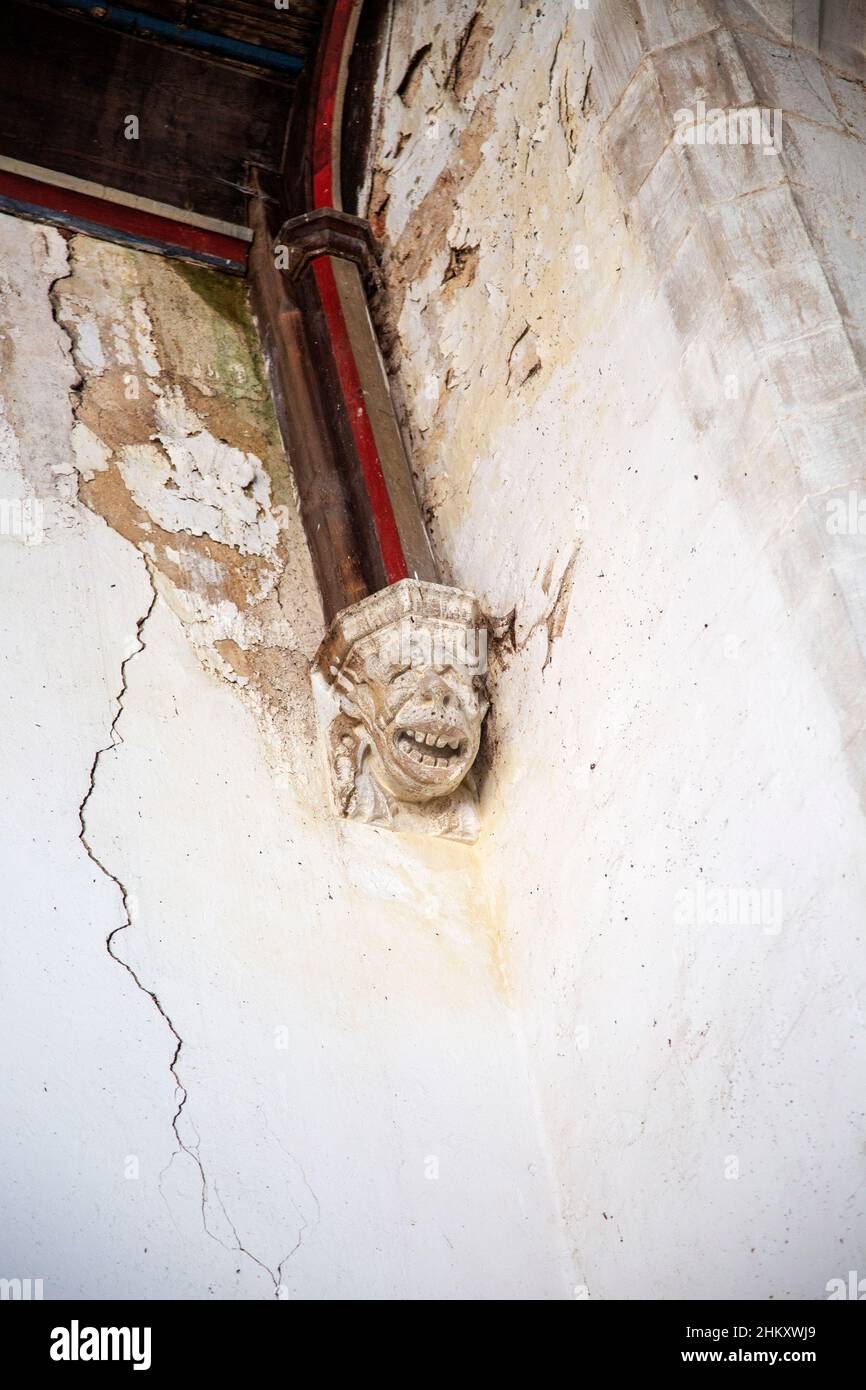 Carved corbel head of crazed wide eyed person, Thrandeston church ...
