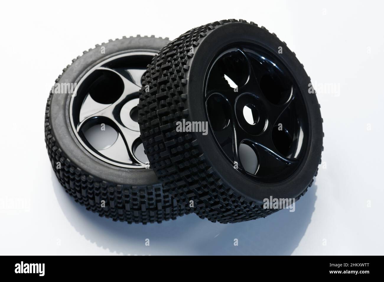 Clean new pair of wheels with black rim isolated on studio background ...