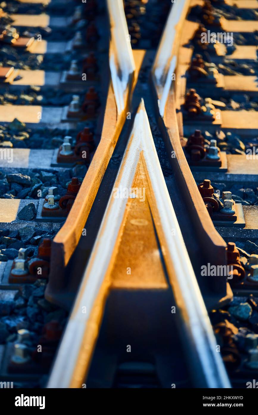 Railway crossing and traffic light in orange backlight Stock Photo - Alamy