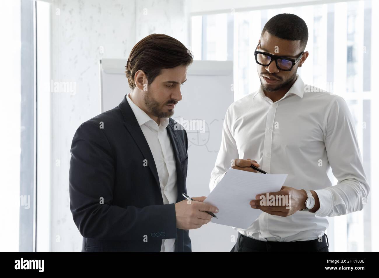 Two men reading paper hi-res stock photography and images - Alamy