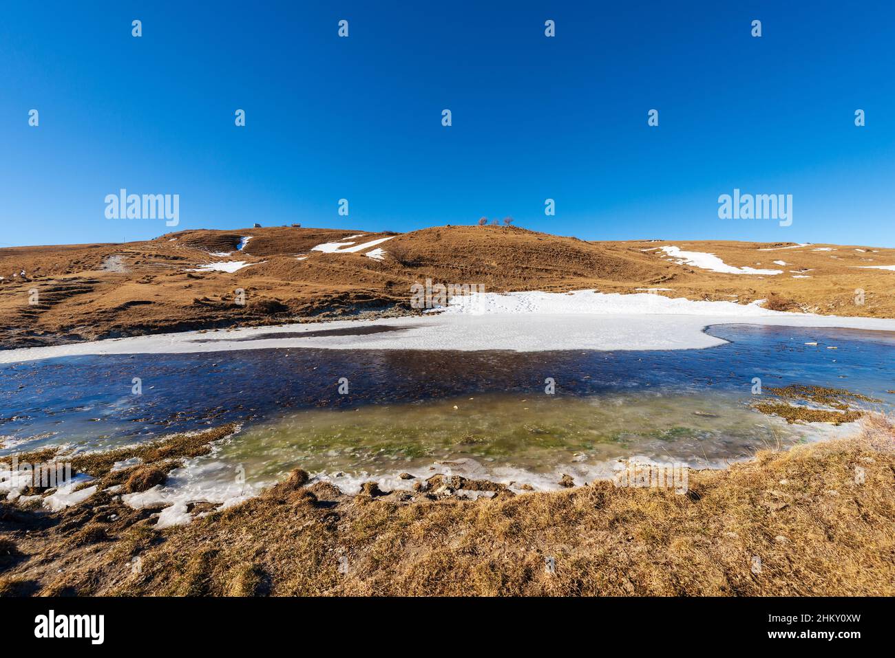 Winter landscape of Lessinia Plateau Regional Natural Park with a small ...