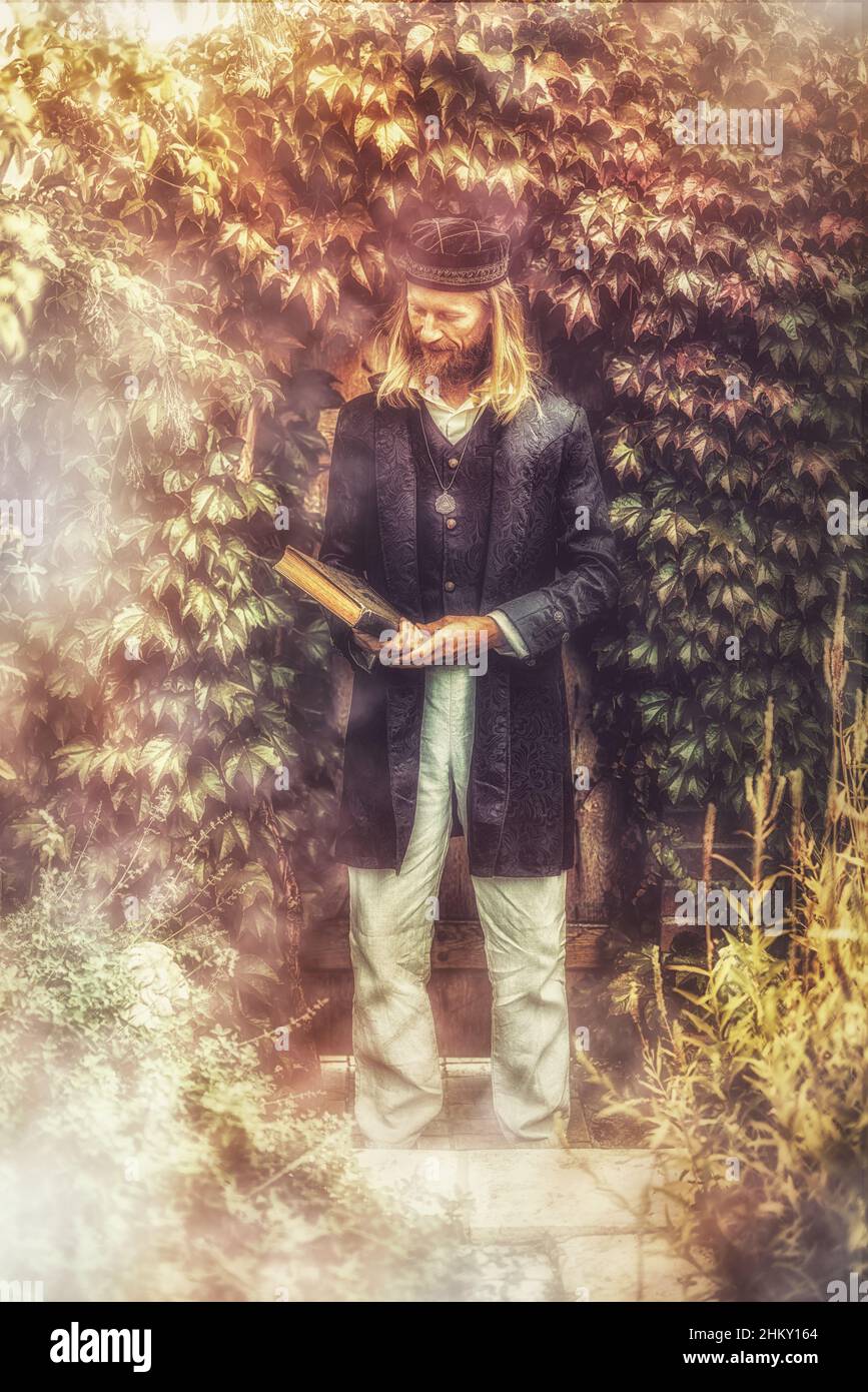 Alchemist in a beautiful ornamental dress in nature Stock Photo - Alamy