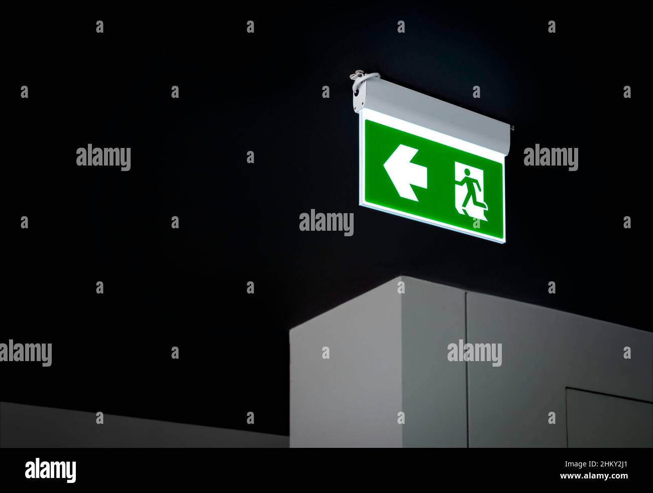 Fire exit sign. Green electric emergency evacuation escape sign with ...
