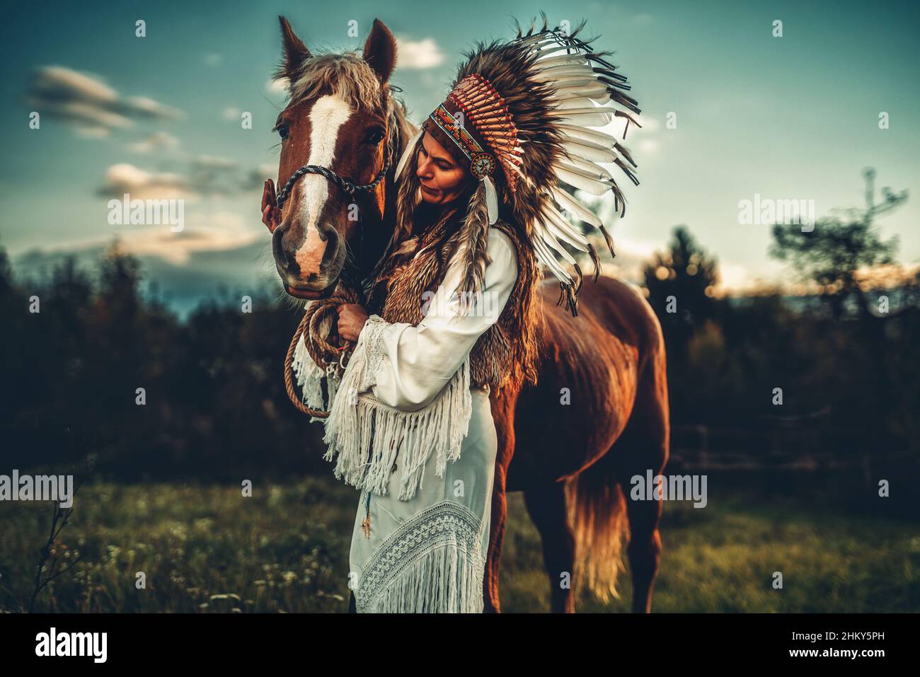 Shaman woman in landscape with her horse Stock Photo - Alamy