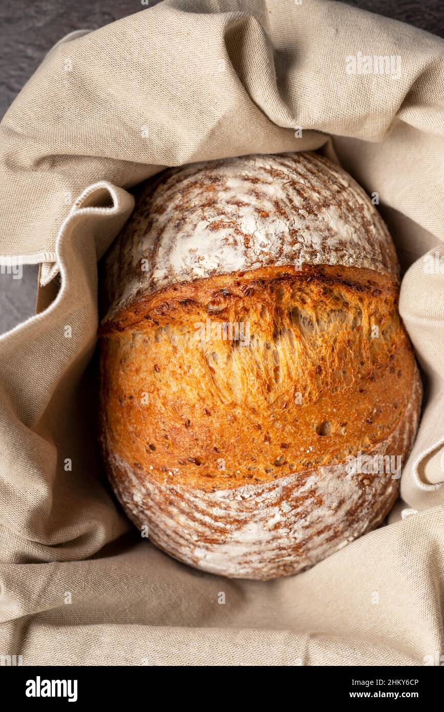 Sourdough bread on linen cloth in basket Stock Photo - Alamy