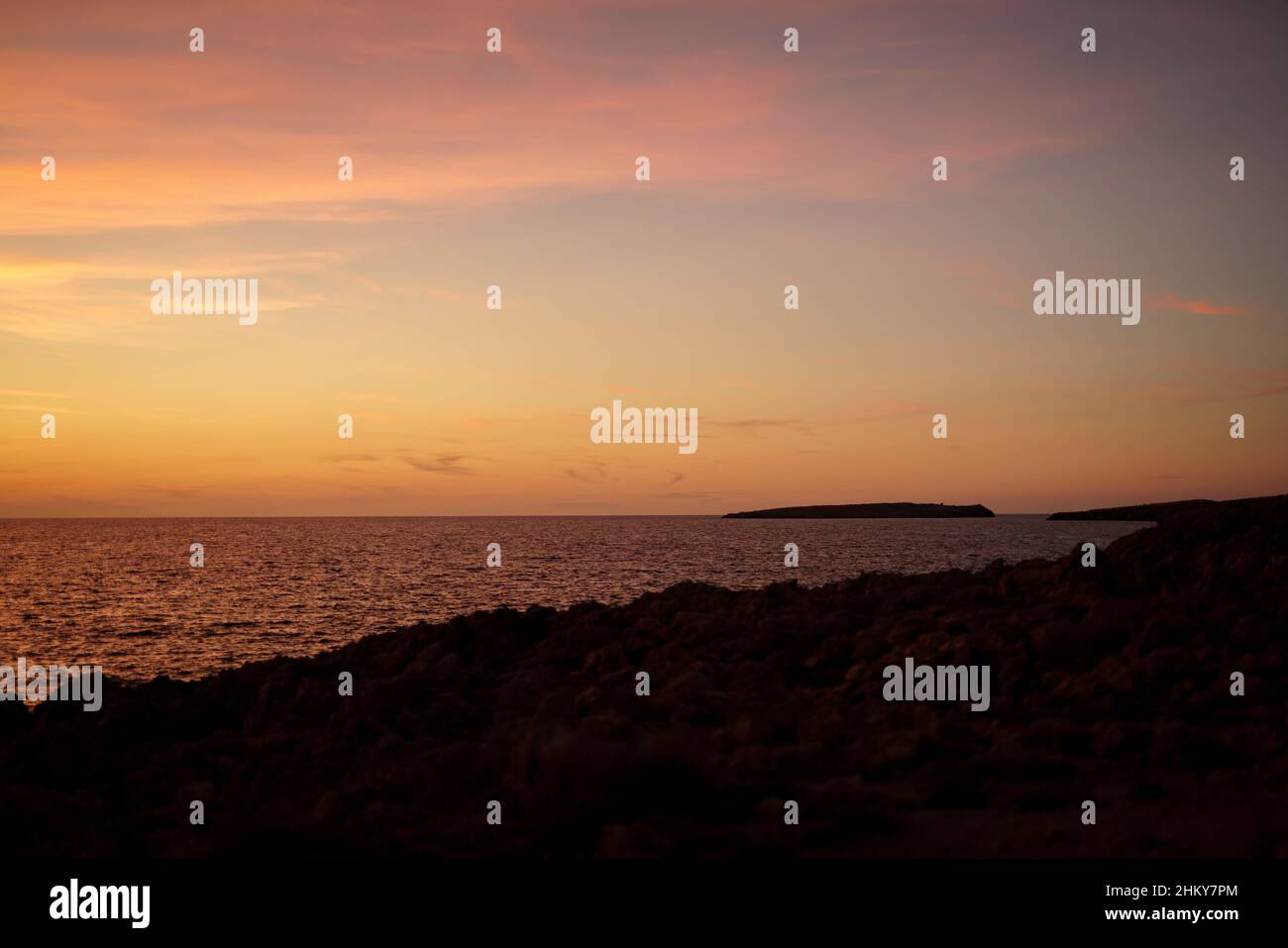 Orange sunset in Menorca Stock Photo - Alamy