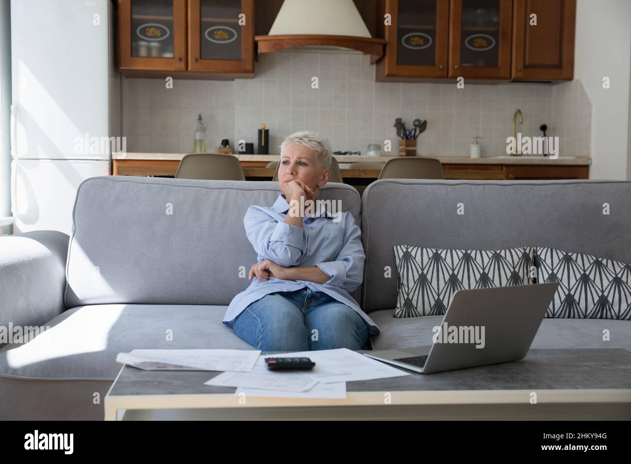 Professional thinking mature woman hi-res stock photography and images ...