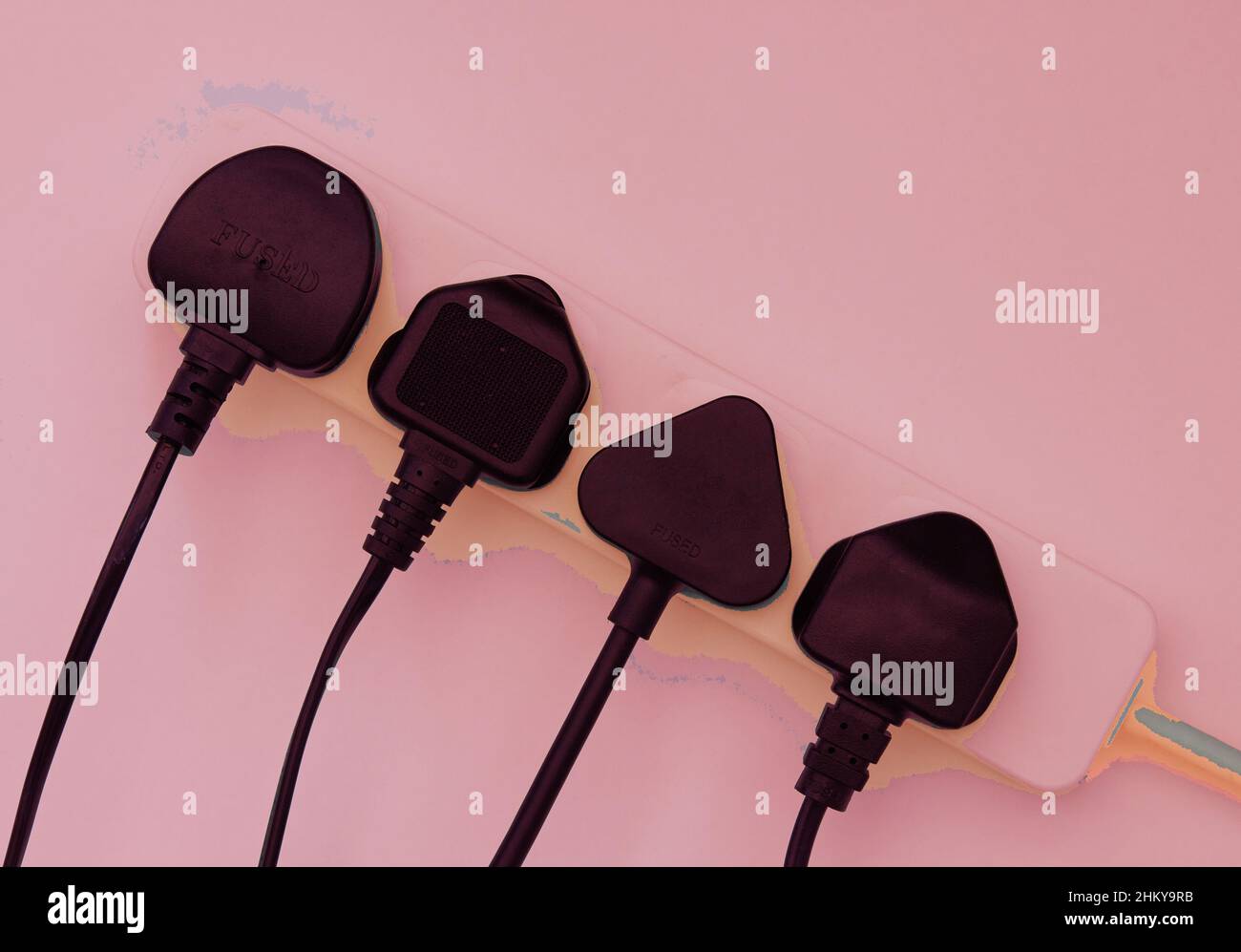 Colourful representation of a multi socket extension with plugs pugged ...