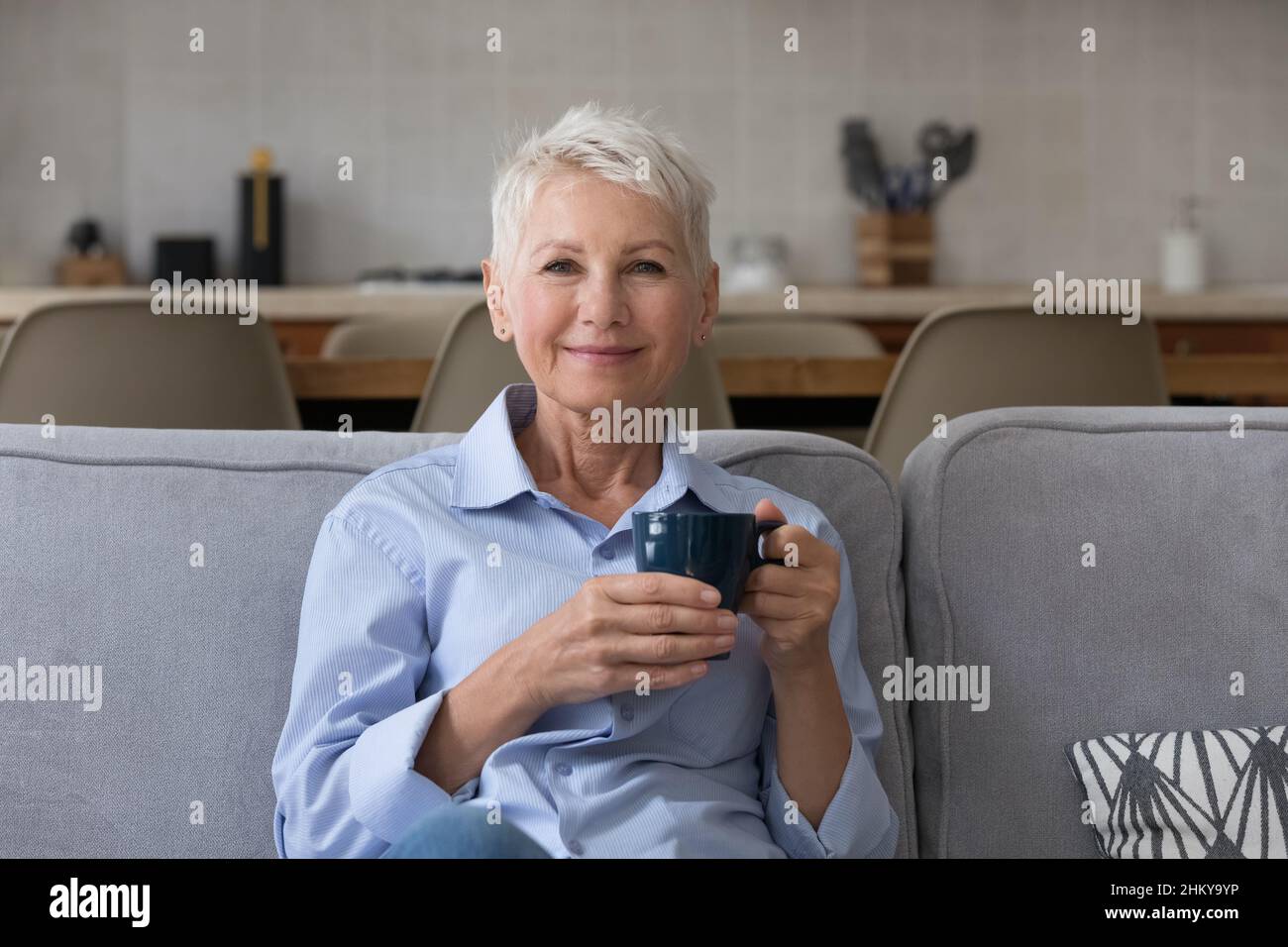 Happy calm carefree middle aged lady enjoying good morning Stock Photo ...