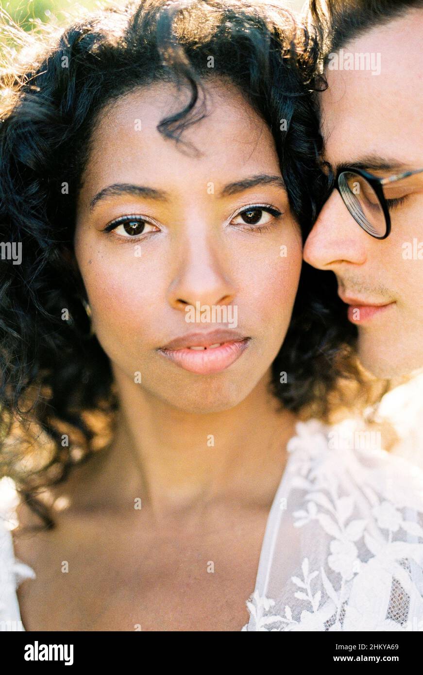 Man touches woman cheek with his nose. Close-up Stock Photo - Alamy