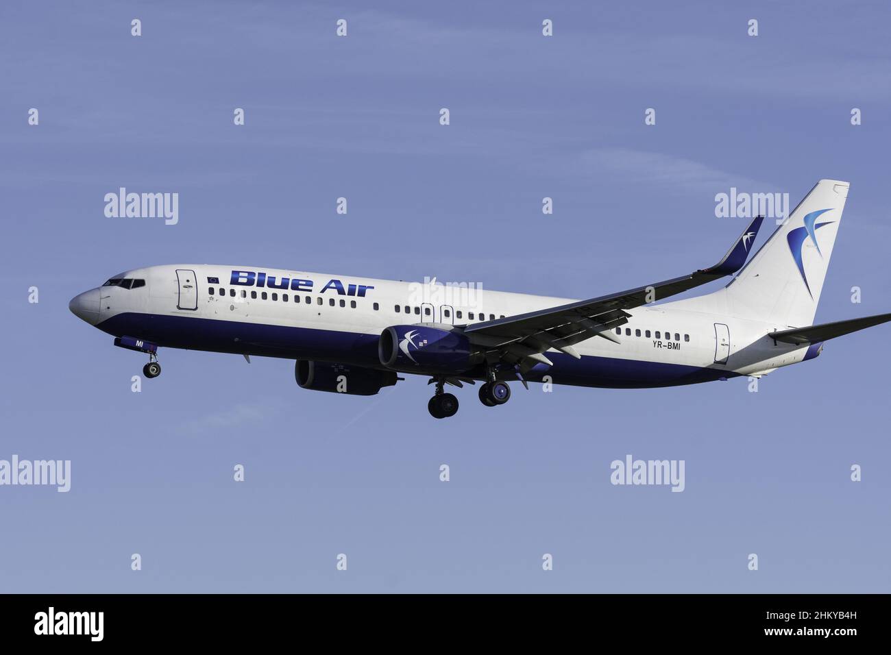 Closeup shot of a YR-BMI Boeing 737-8K5 Blue Air flying in the sky ...