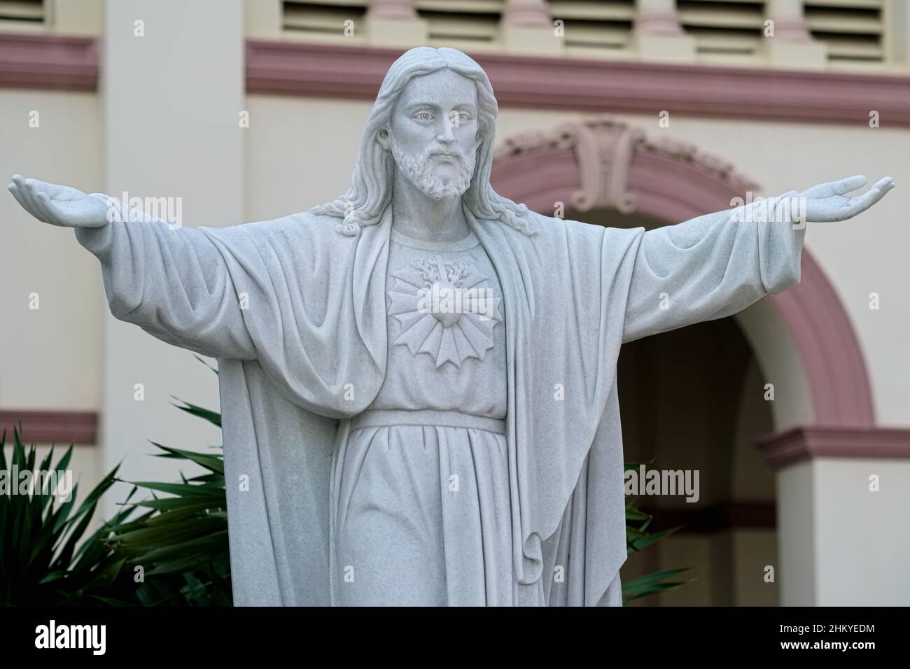 A statue of Jesus Christ in front of Portuguese-built Santa Cruz Church ...