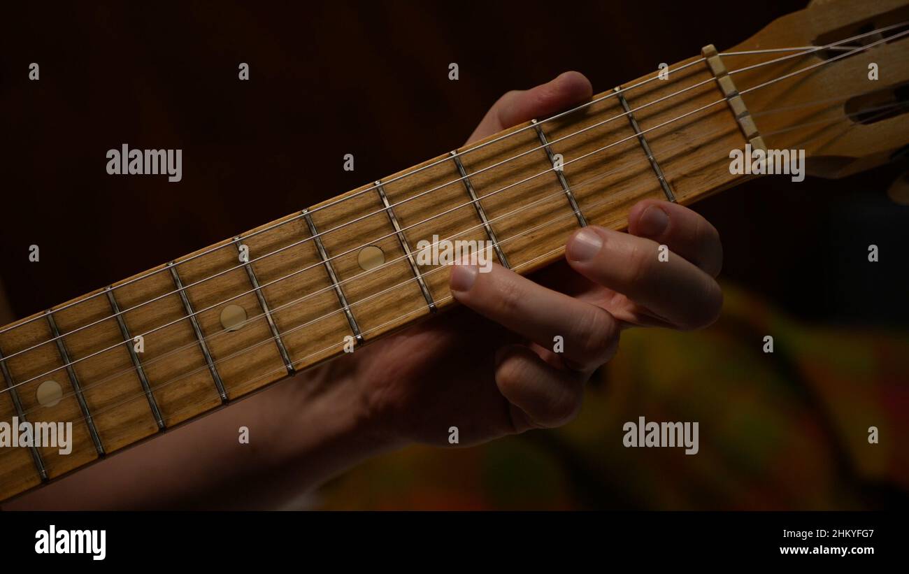 Playing the guitar. Strumming acoustic guitar. Man's hand with a guitar ...