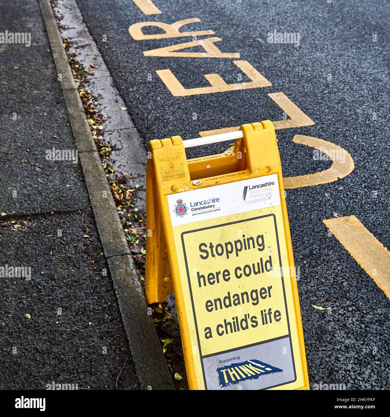 Lancashire road safety partnership sign on road in front of school ...