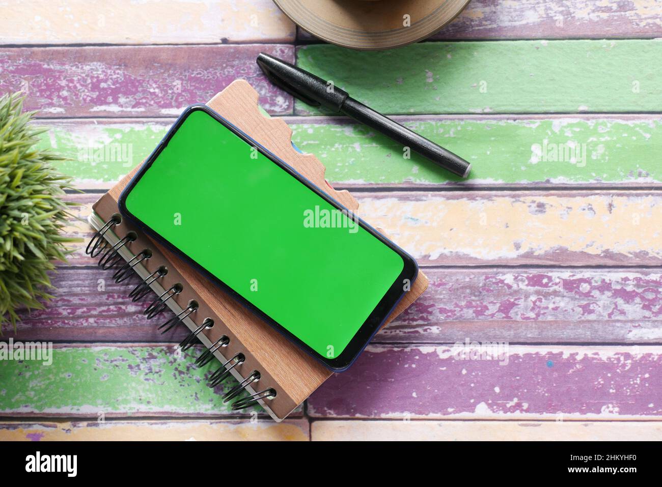 top view of smart phone and notepad on table Stock Photo - Alamy