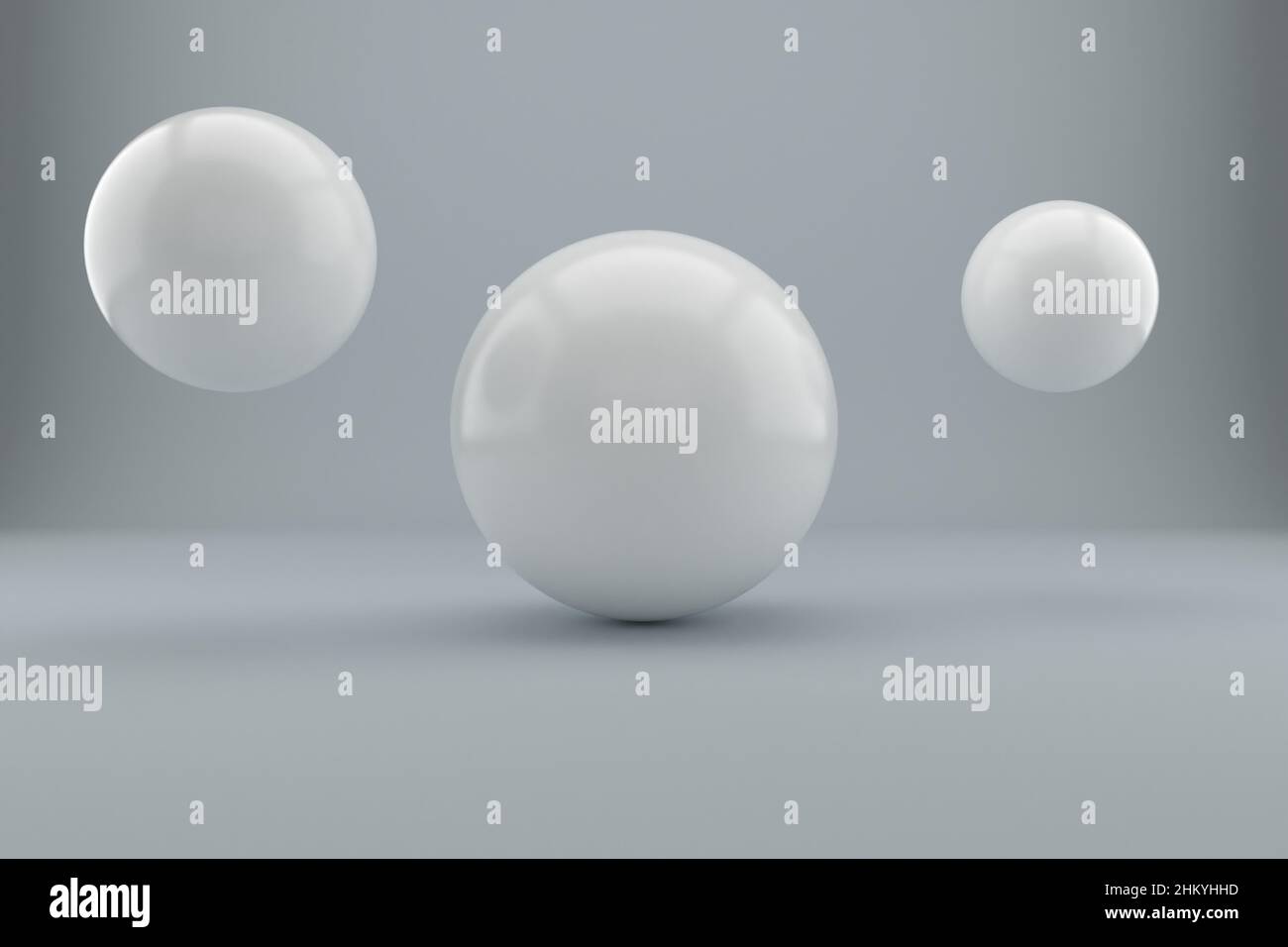 3d rendering of several sized reflected white spheres inside a white ...