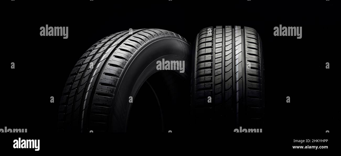 new beautiful tires on a black background, tire change season Stock ...