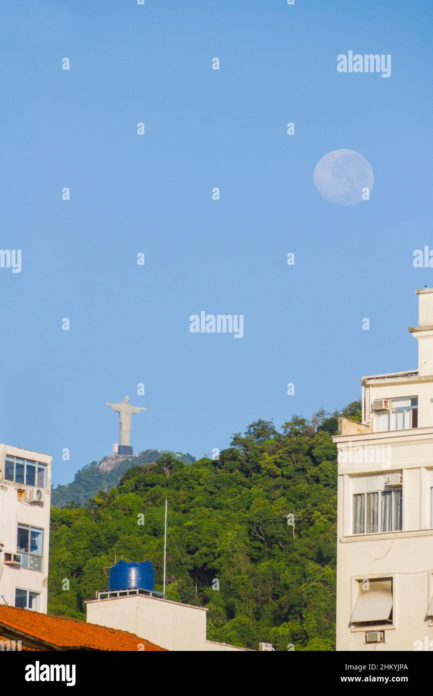 Christ the Redeemer and the Moon seen from Copacabana in Rio de Janeiro ...