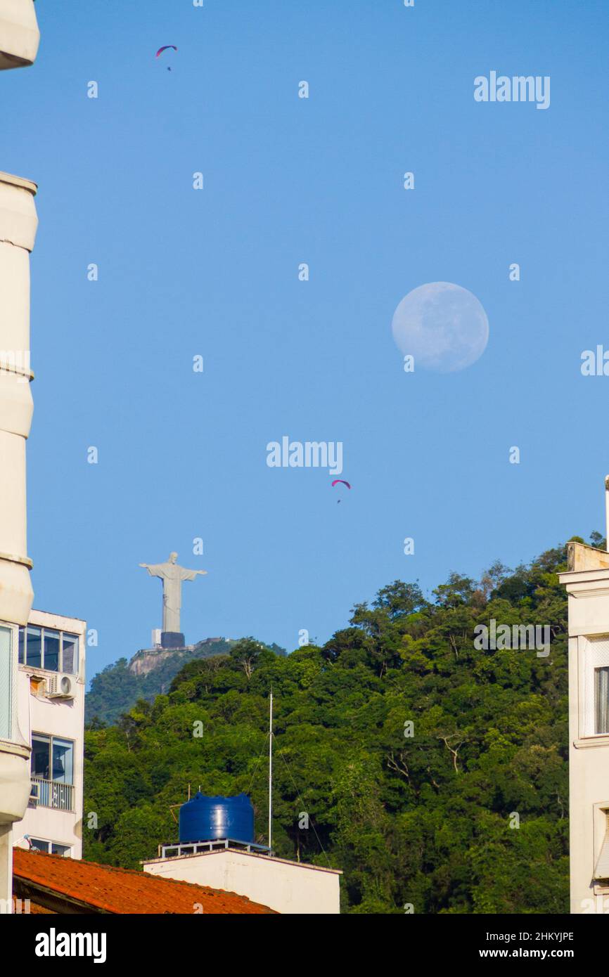 Christ the Redeemer and the Moon seen from Copacabana in Rio de Janeiro ...