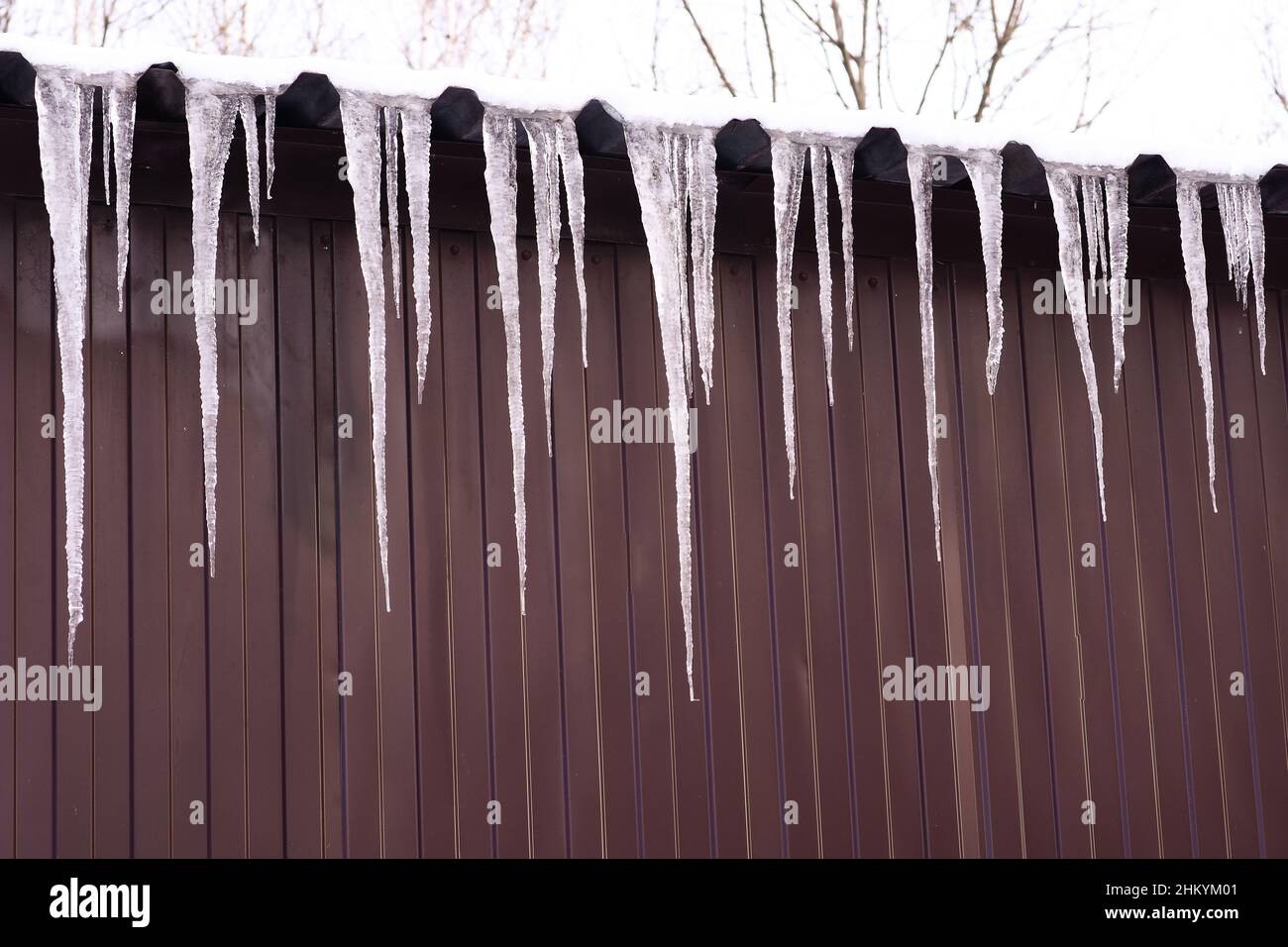 icicles hanging from the roof Stock Photo - Alamy