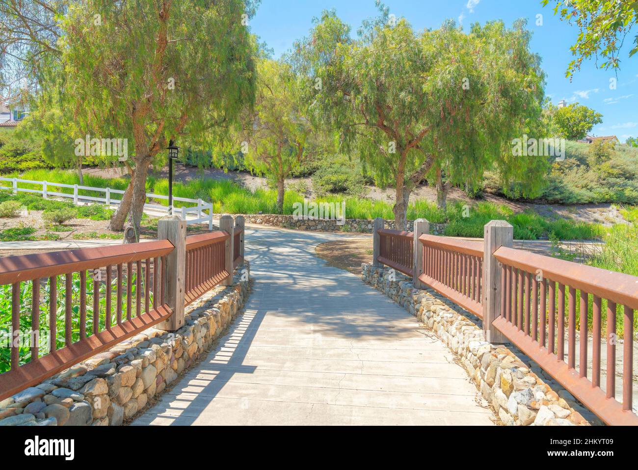 Concrete walkway in the middle of railings on a stone foundation at ...