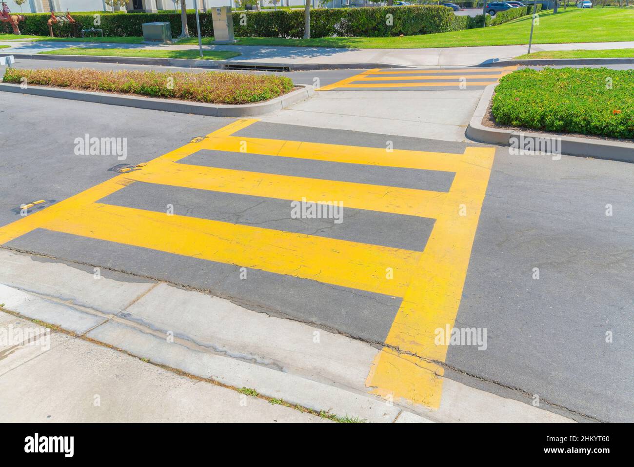 Yellow pedestrian lanes at the crosswalk in Ladera Ranch, California ...