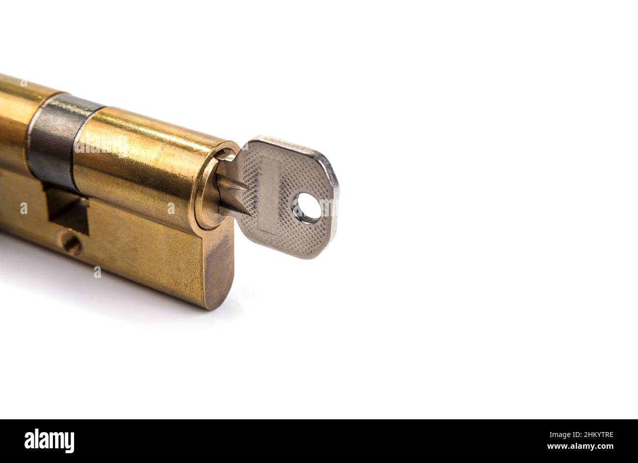 Cylinder lock with a key on a white background Stock Photo - Alamy