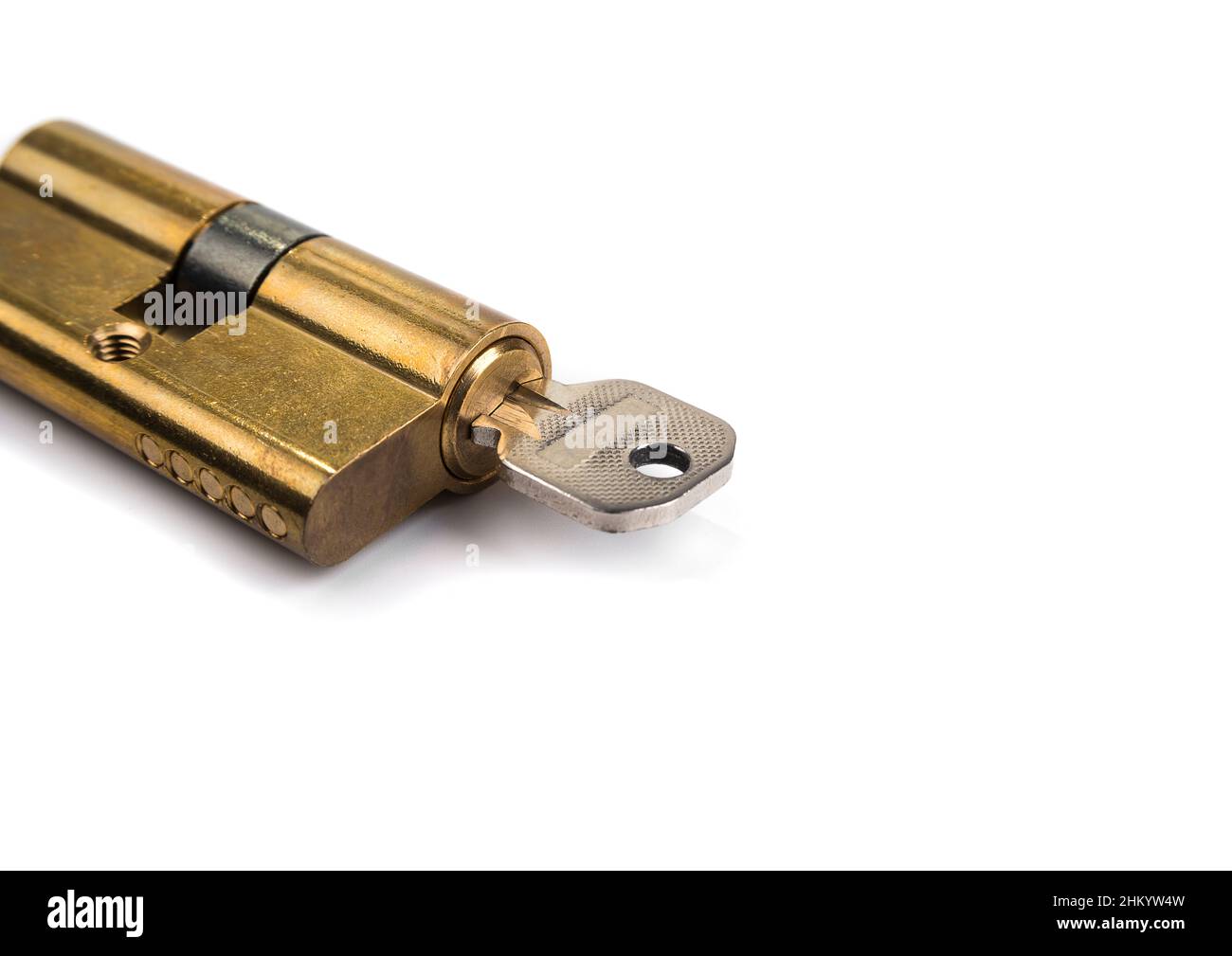 Cylinder lock with a key on a white background Stock Photo - Alamy