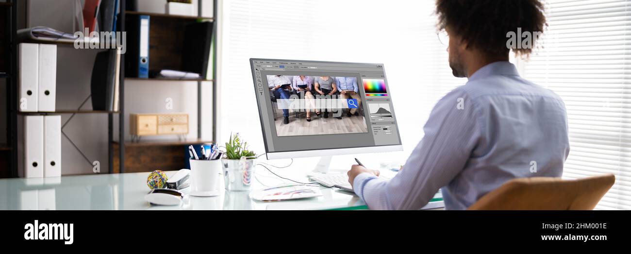 African Graphic Web Designer Using Design Editing Software Stock Photo ...