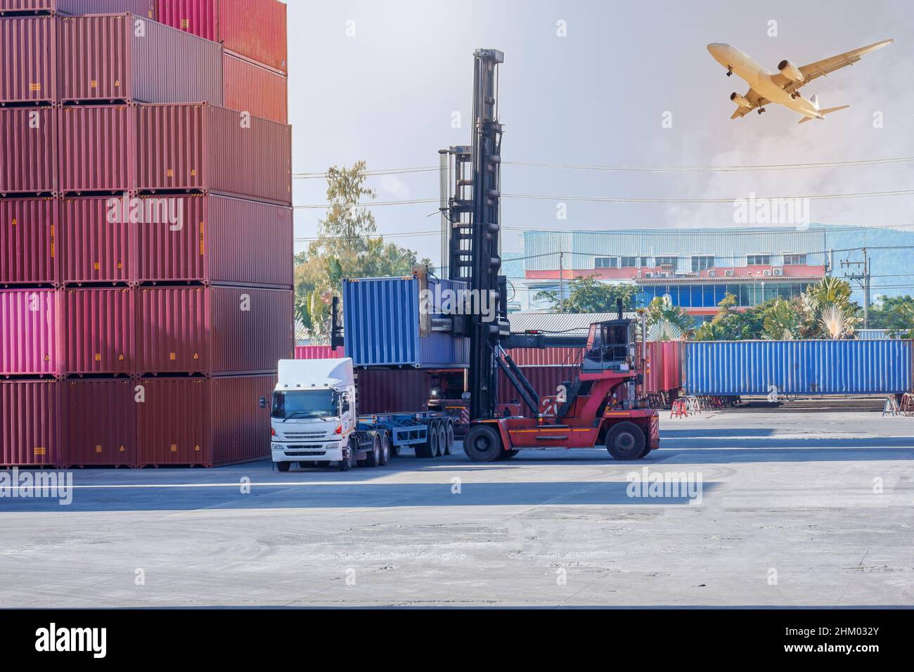 Container yard with container forklift Stock Photo - Alamy