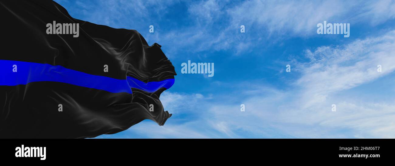 Thin Blue Line flag waving at cloudy sky background on sunset ...