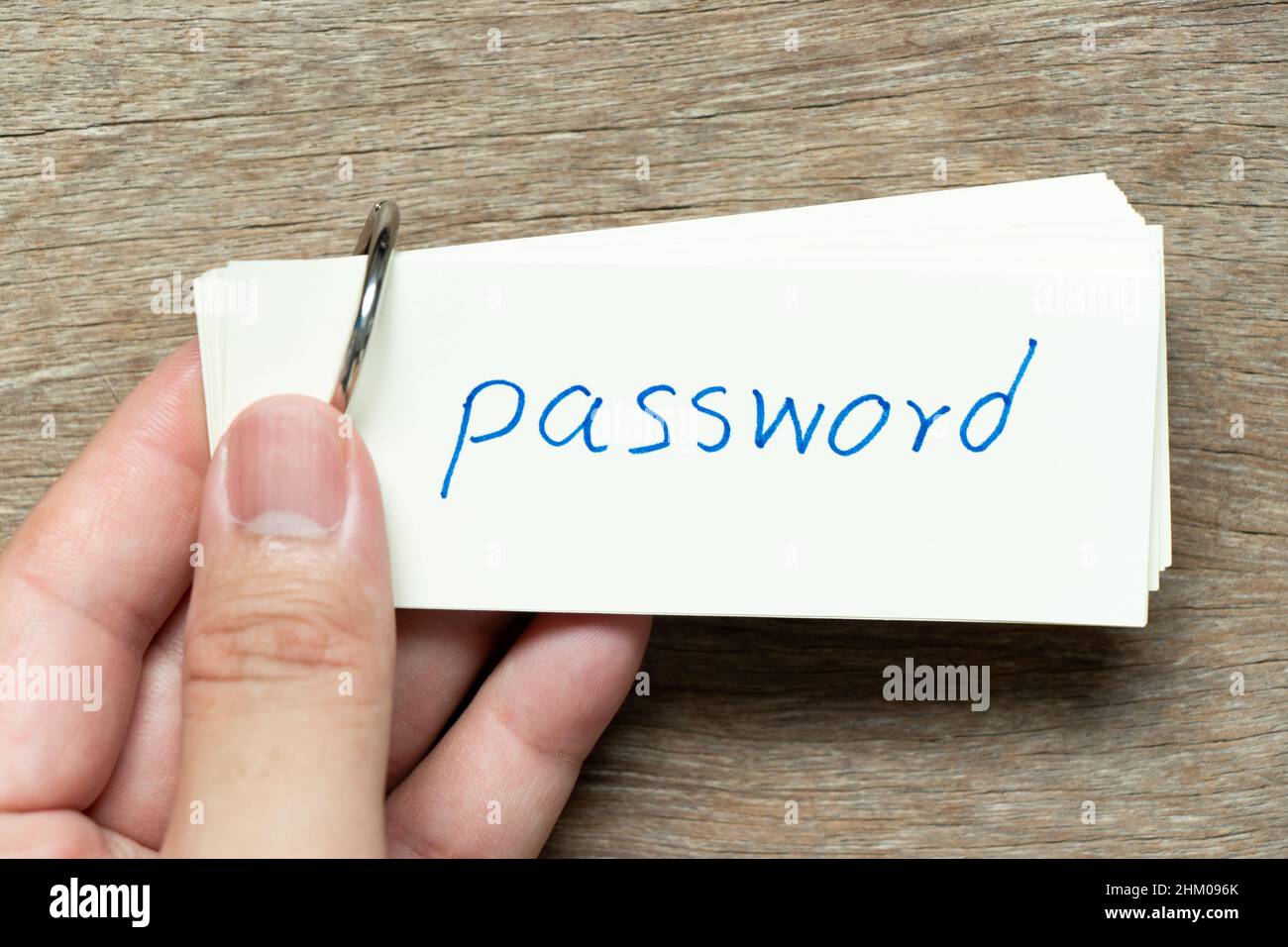 Man hold the flash card with handwriting word password on wood ...