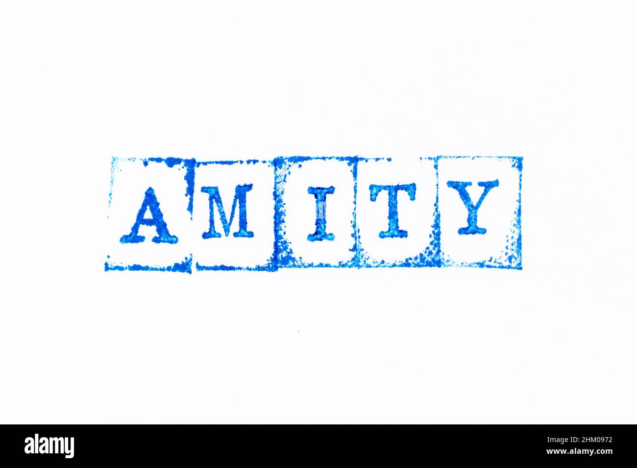 Blue color ink rubber stamp in word amity on white paper background ...
