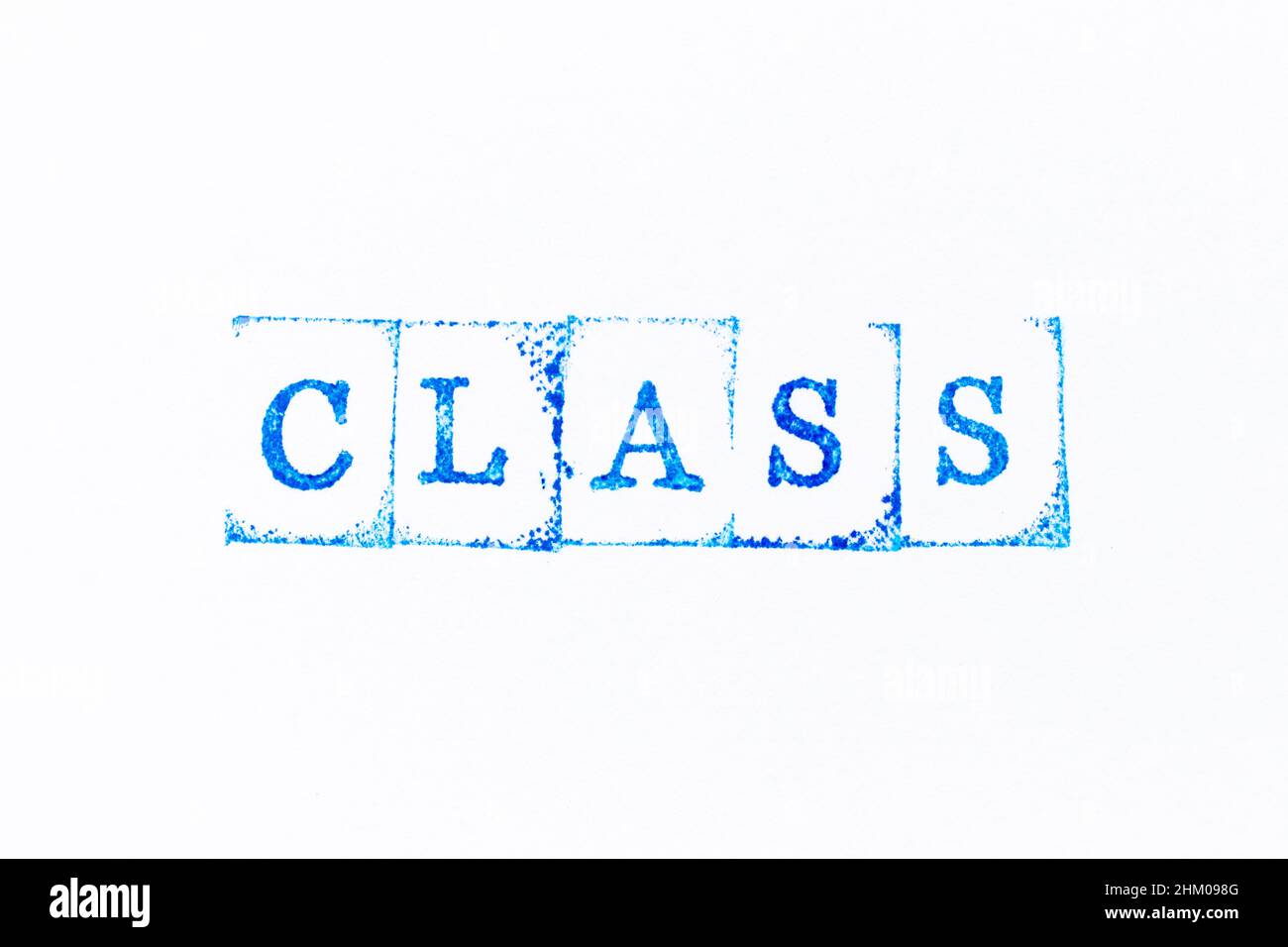 Blue color ink rubber stamp in word class on white paper background ...