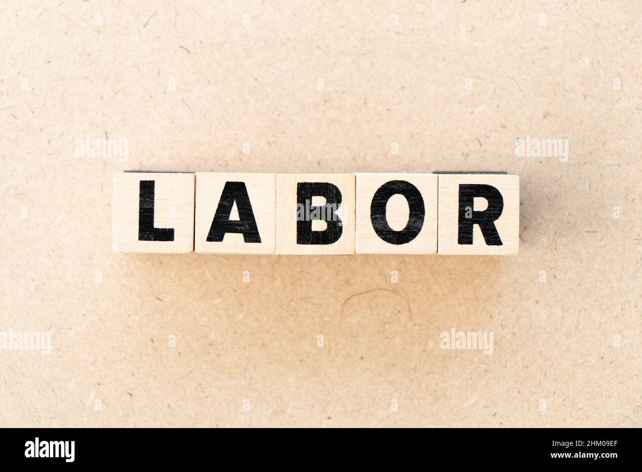 Alphabet letter block in word labor on wood background Stock Photo - Alamy