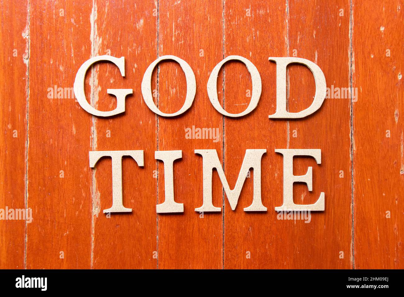 Alphabet letter in word good time on old red color wood plate ...