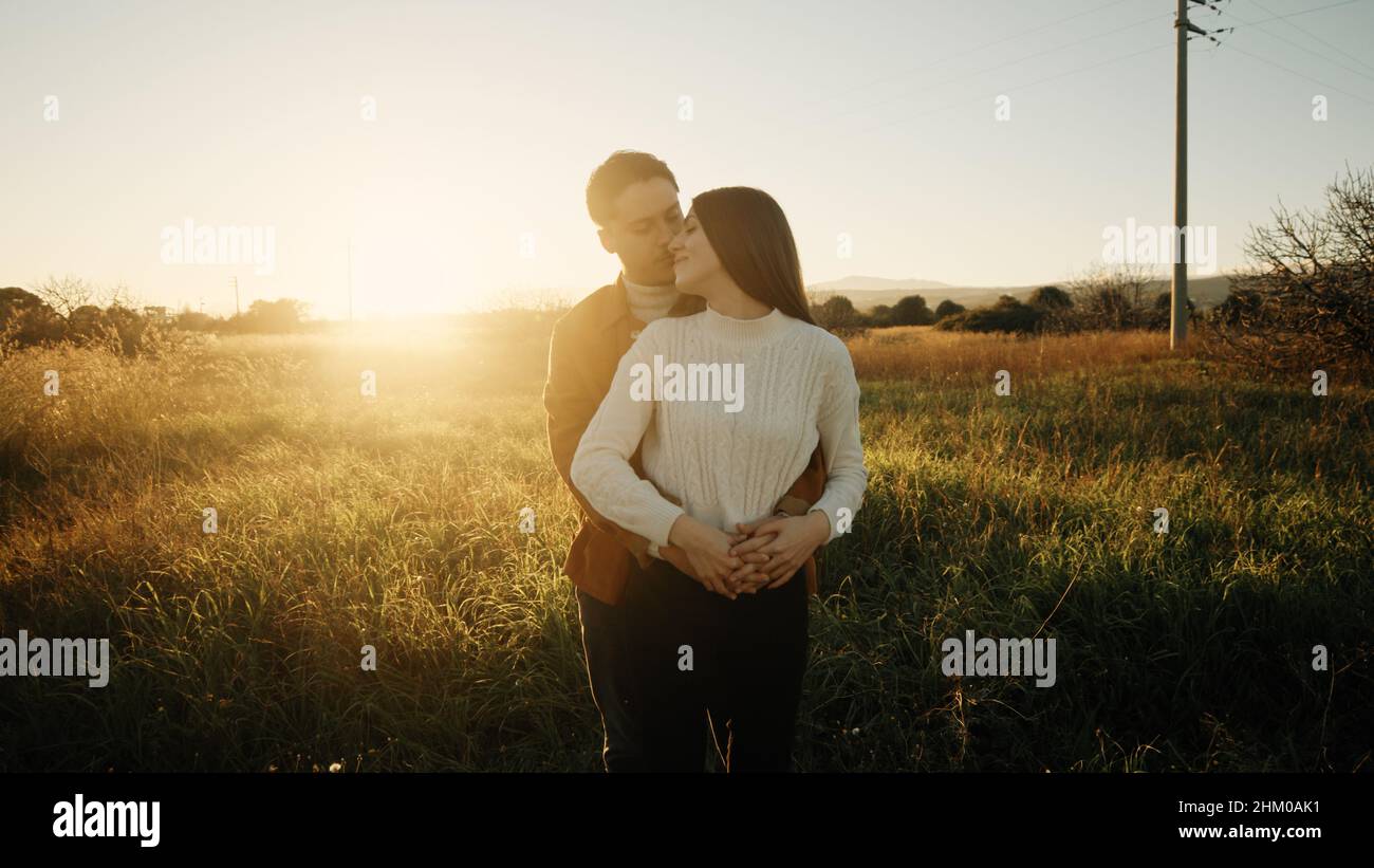 Romantic Couple Hugging outdoor At Sunset Light Stock Photo - Alamy
