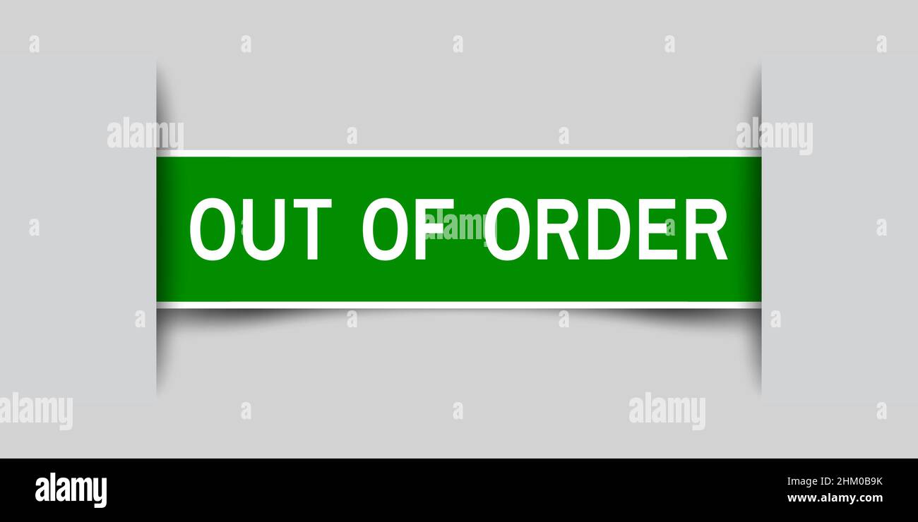 Inserted green color label sticker with word out of order on gray ...
