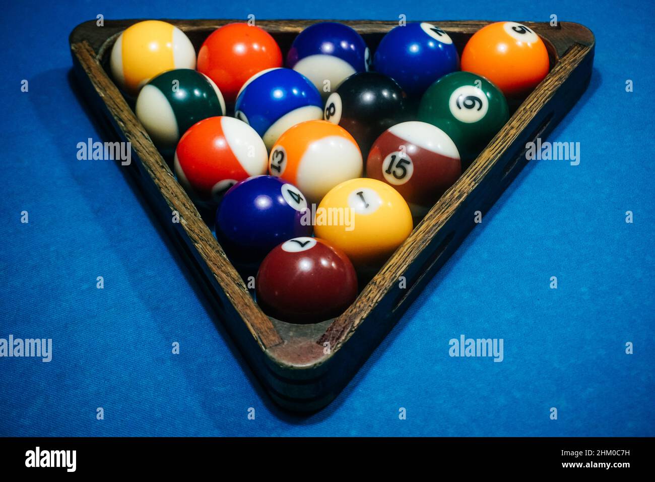Pool game - balls and triangle on a table Stock Photo - Alamy