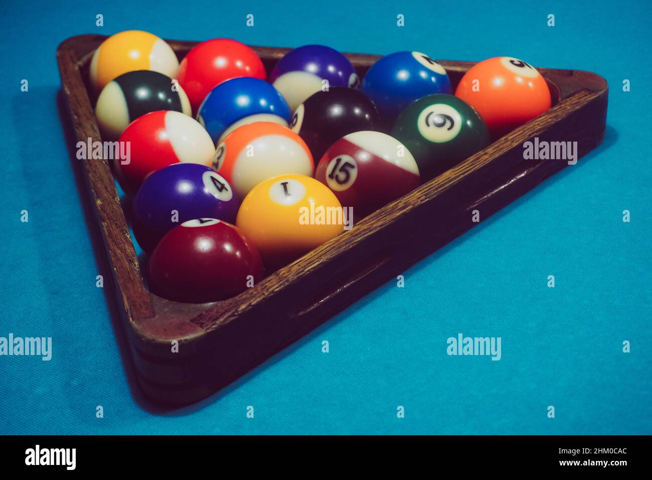 Pool game - balls and triangle on a table Stock Photo - Alamy
