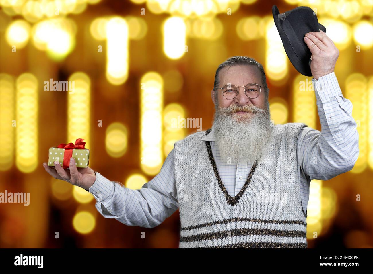 Man presenting gift box hi-res stock photography and images - Alamy